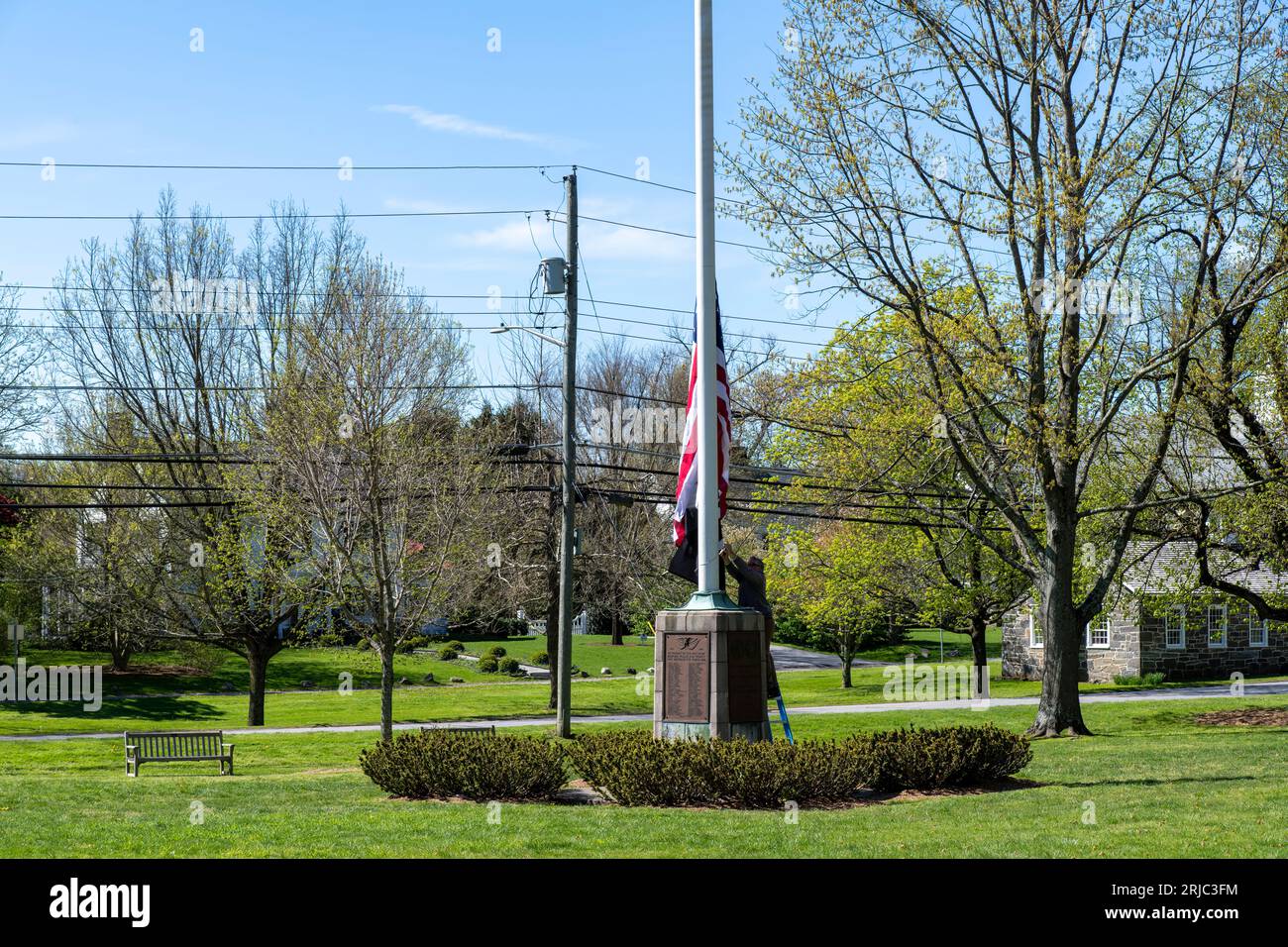 Bedford, NY, USA-May 2022; View over the village green with a man ...