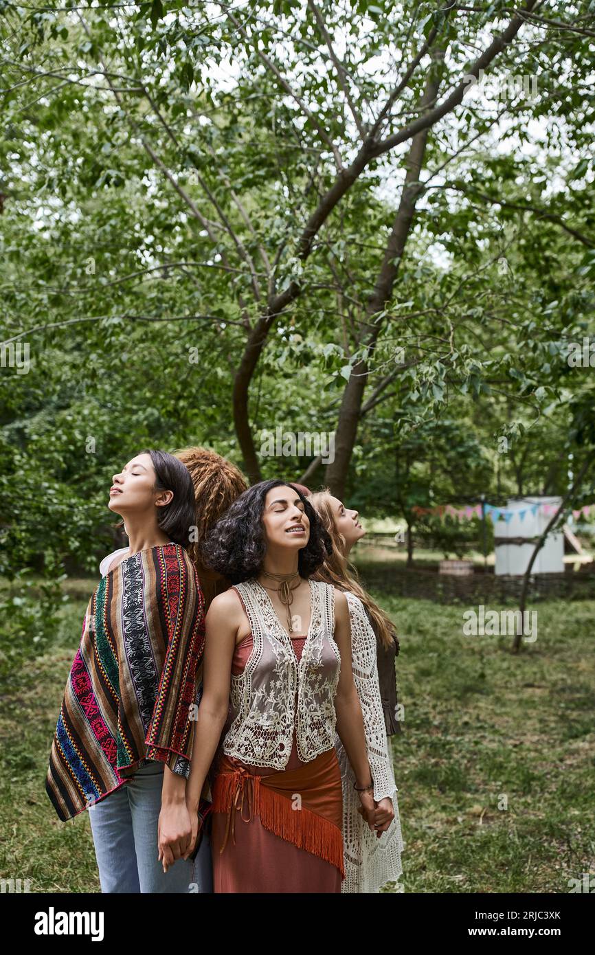 Smiling Interracial Women Holding Hands While Standing Back To Back In 8153
