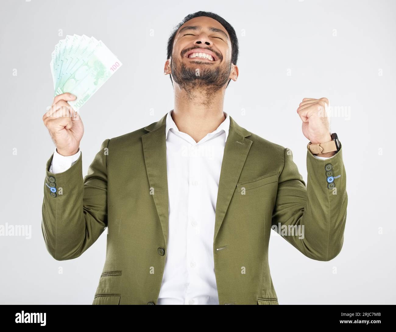 Money, winner and man with fist celebration in studio for payment, loan ...