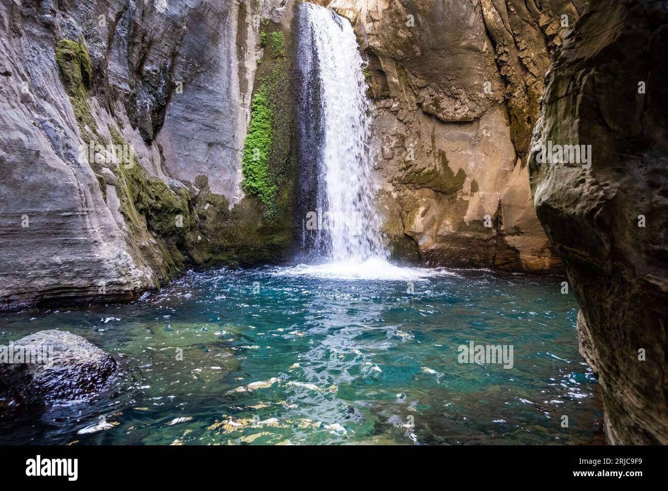 A beautiful mountain gorge with a river and a waterfall Stock Photo - Alamy