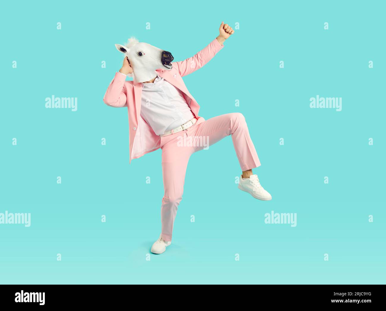 Funny crazy man wearing horse head mask dancing Stock Photo - Alamy