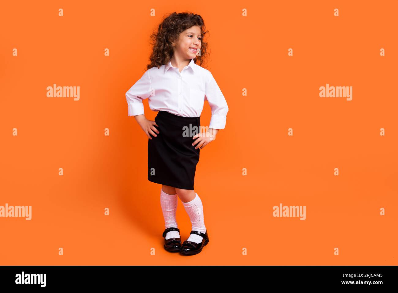 Photo of cute smart kid girl dressed new uniform prepared for first ...