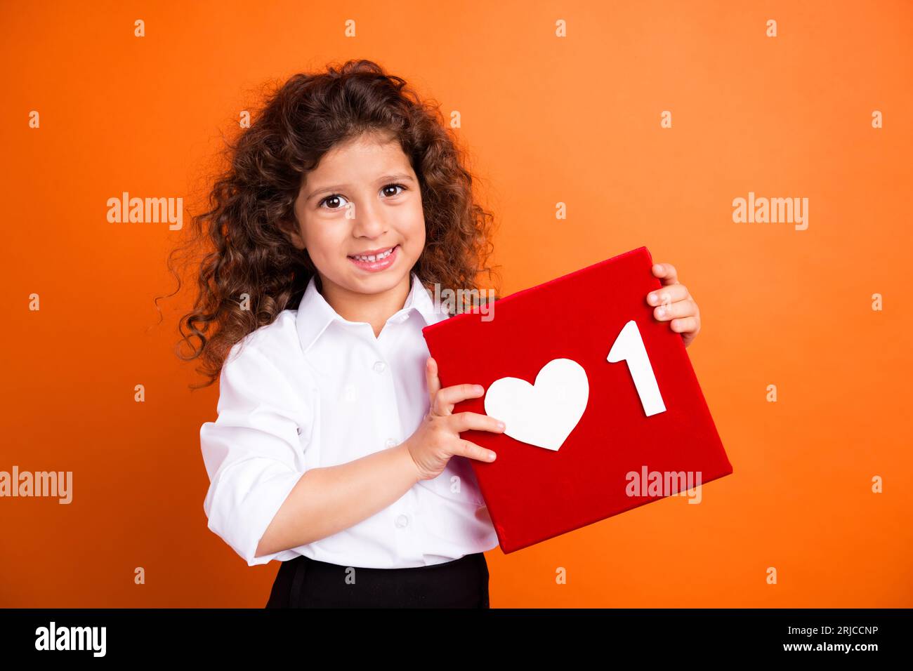 Photo of sweet cheerful friendly schoolkid beaming smile arms hold ...