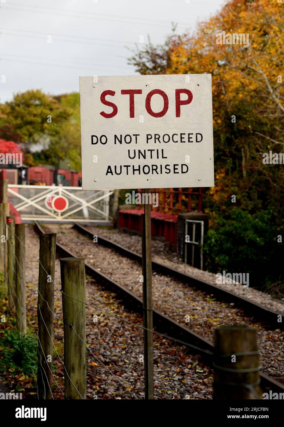 Stop sign at level crossing gates at Bitton station on the Avon Valley ...