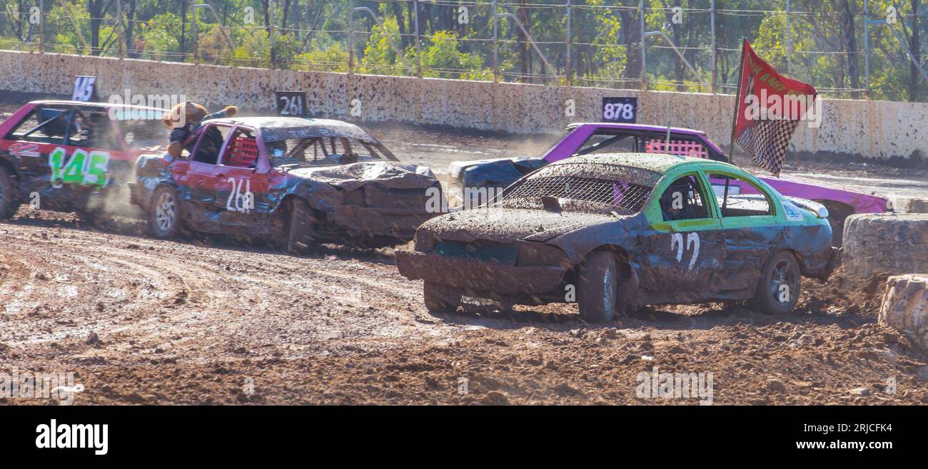 Dirt track racing with amateur stock cars. Heaps of lying mud as the ...