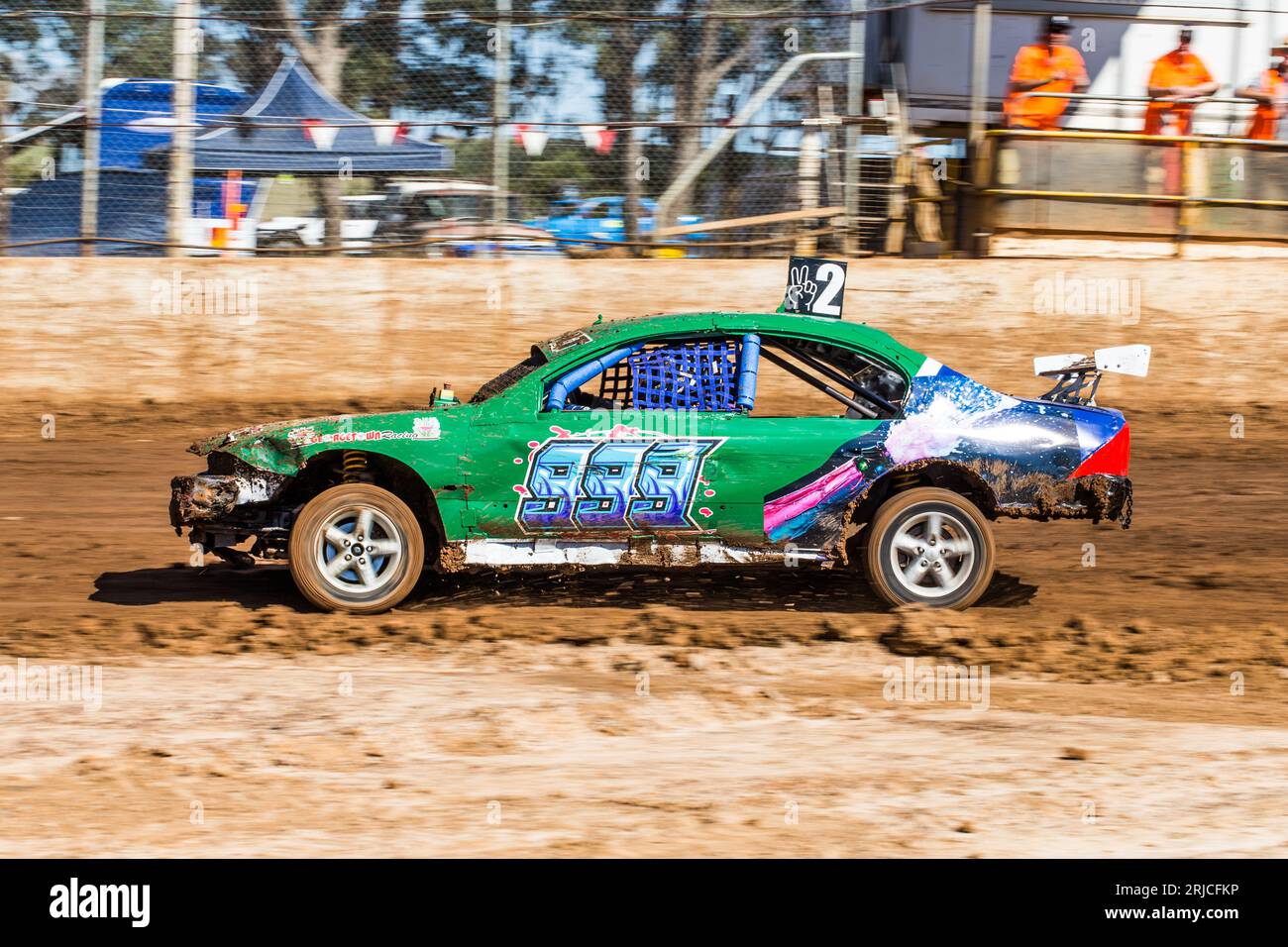 Dirt track racing with amateur stock cars. Heaps of lying mud as the ...