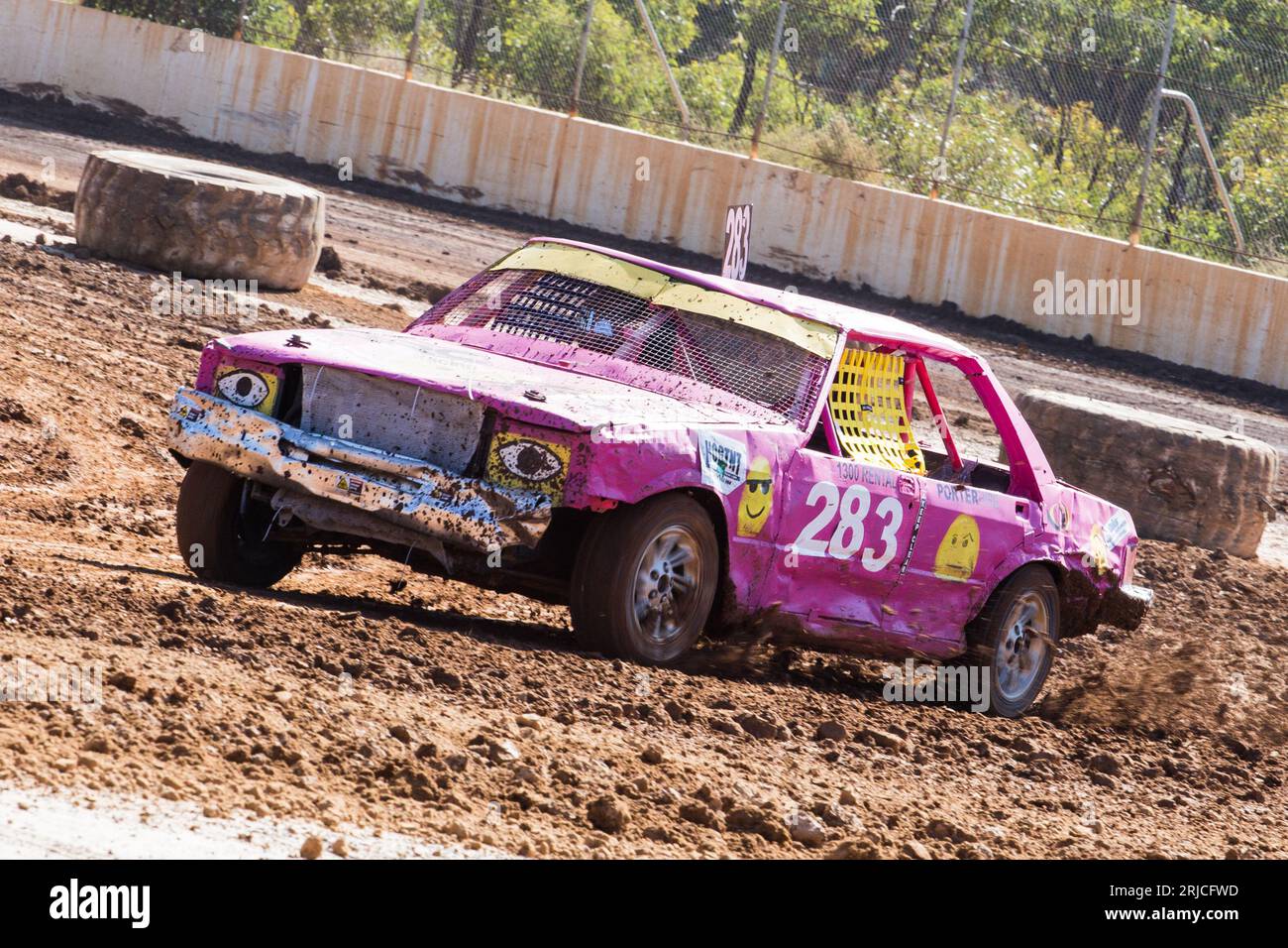 Dirt track racing with amateur stock cars. Heaps of lying mud as the ...