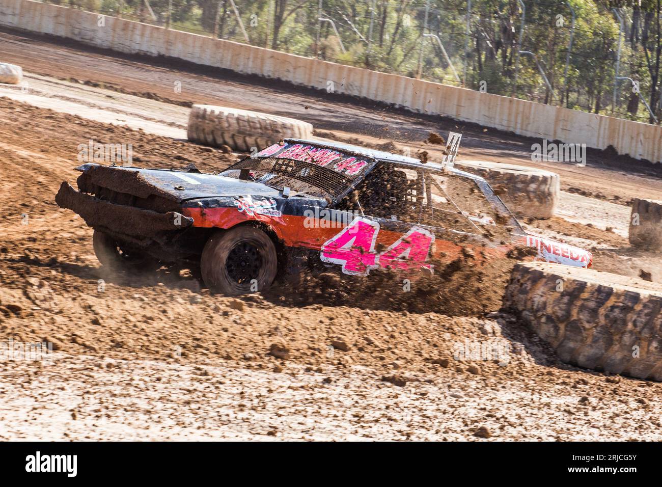 Dirt track racing with amateur stock cars. Heaps of lying mud as the ...