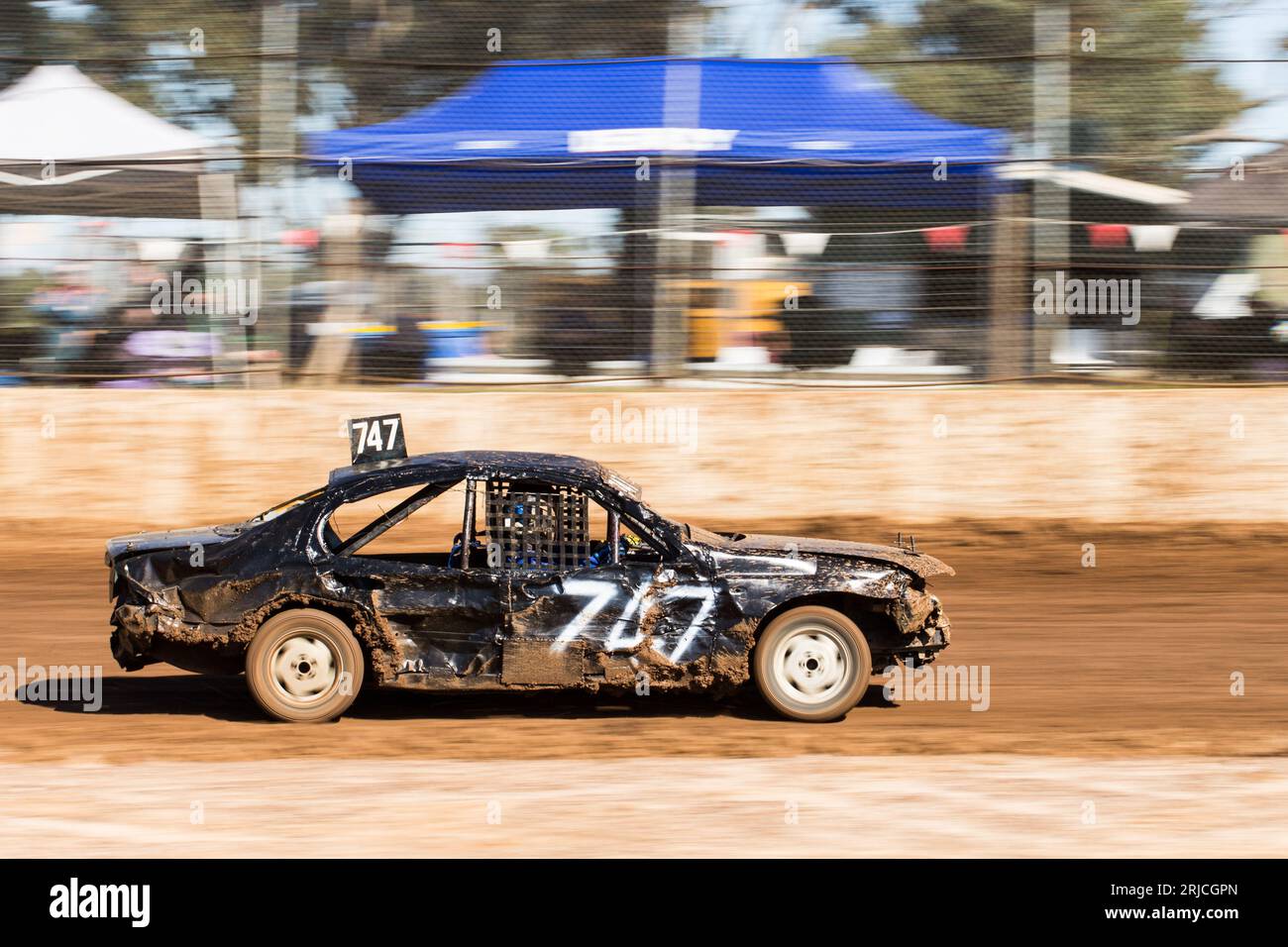 Dirt track racing with amateur stock cars. Heaps of lying mud as the ...