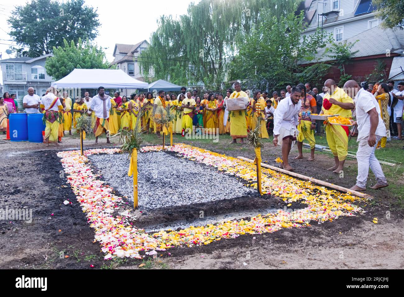 Devout Hindu decorate the fire area with flower petals for the Thimithi ...