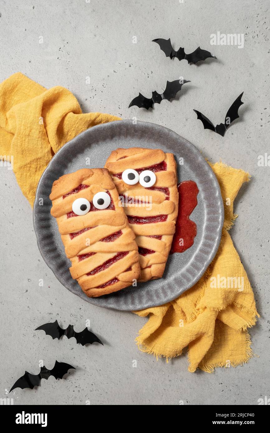Halloween shortbread cookies with strawberry jam. Cookie is a mummy ...