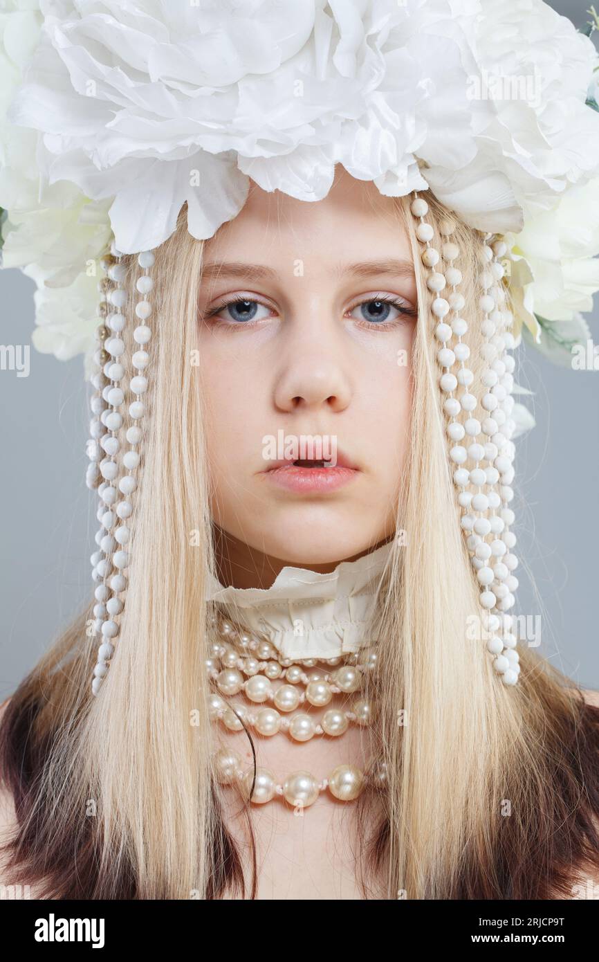 Fashion portrait of stylish teenager girl wearing pearls and white ...