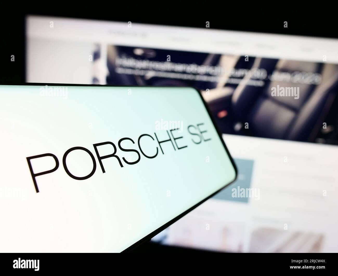 Cellphone with logo of German company Porsche Automobil Holding SE on ...