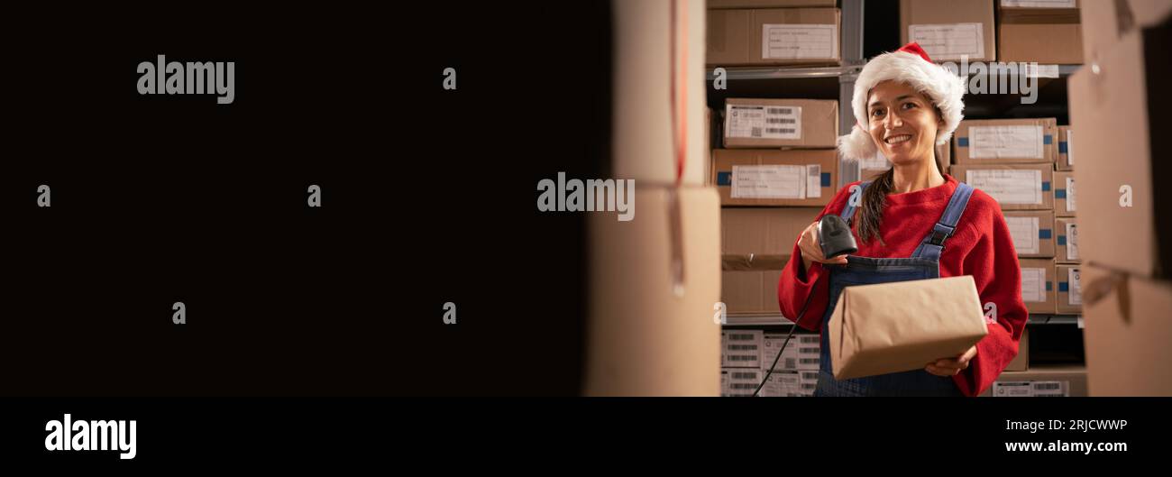 Inventory manager scans cardboard box with barcode scanner, worker ...