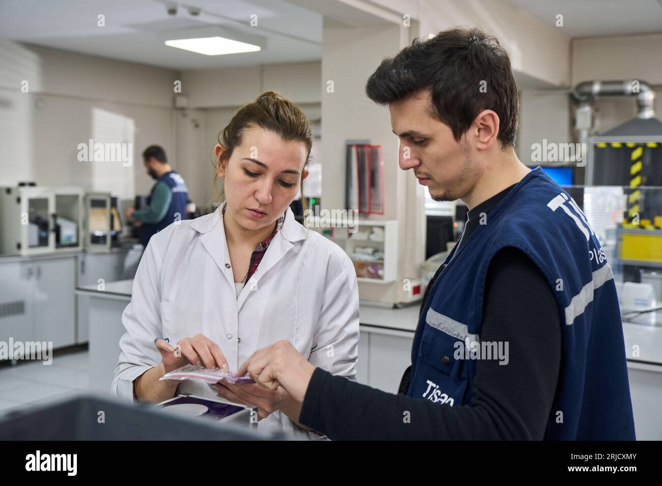 people Working in the laboratory of a modern factory. quality ...