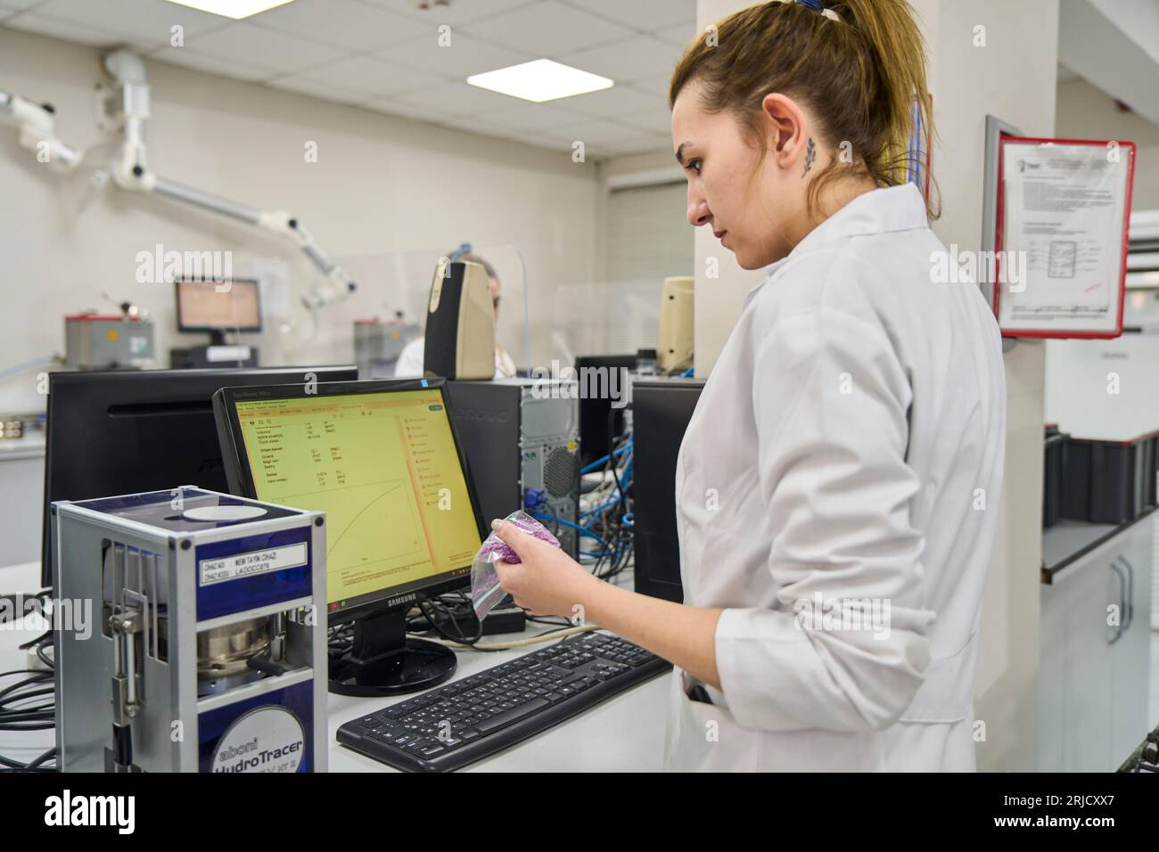 people Working in the laboratory of a modern factory. quality ...
