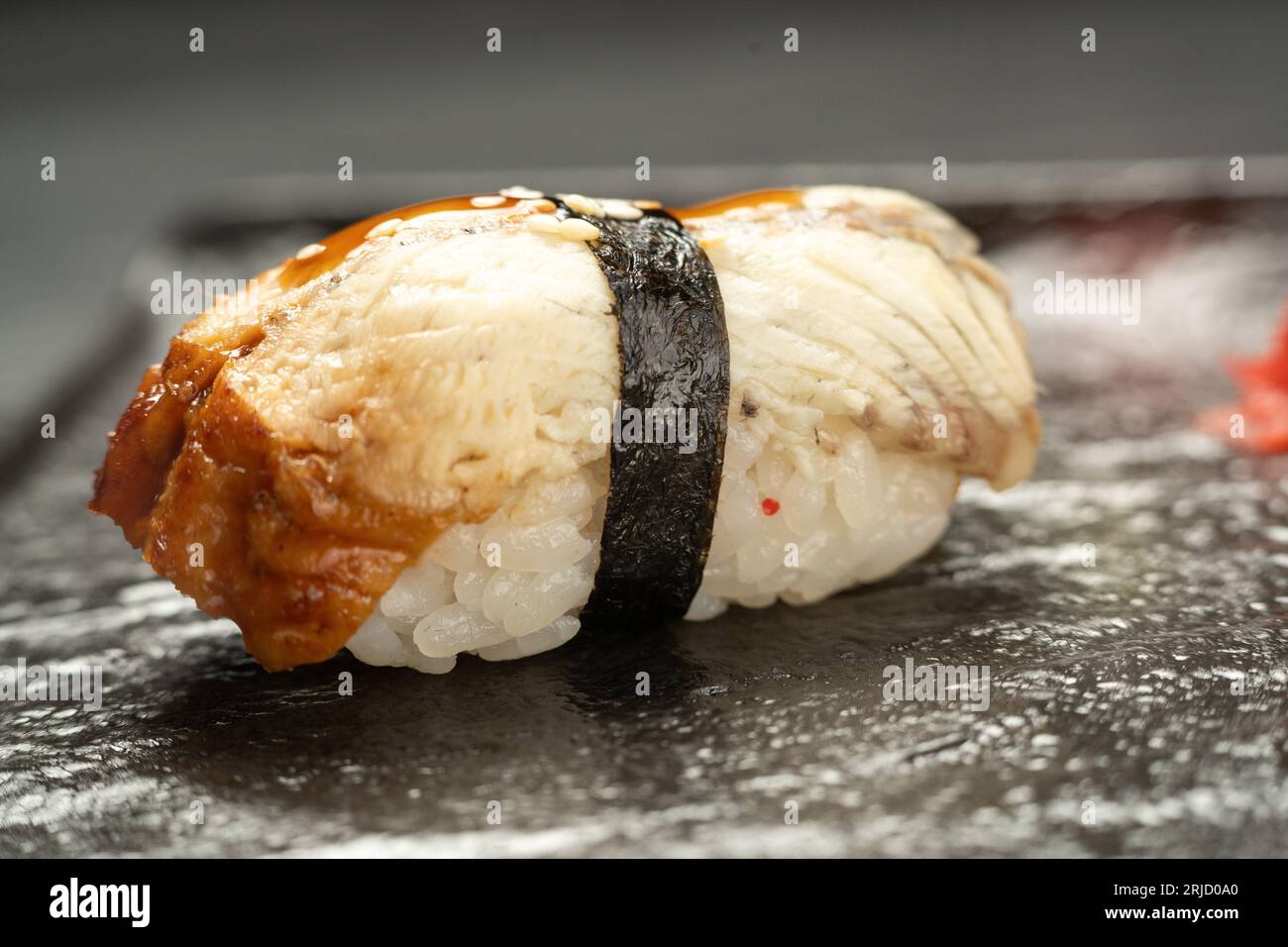 Delicious Unagi Eel Nigiri Sushi on black stone background. Traditional Japanese cuisine Stock ...