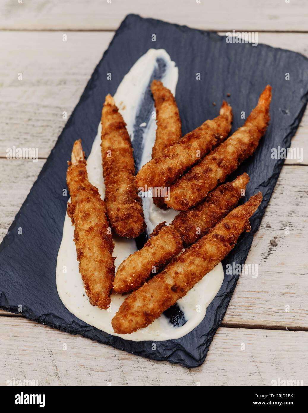 Fried breaded prawns with mayonnaise sauce Stock Photo - Alamy