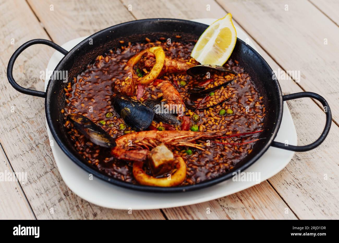 A typical Valencian seafood paella with rice Stock Photo - Alamy