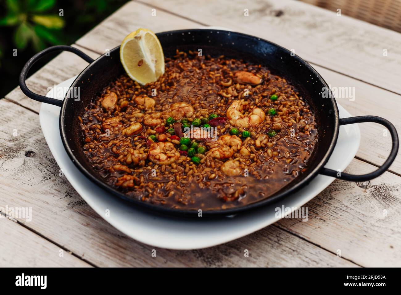 A typical Valencian seafood paella with rice Stock Photo - Alamy