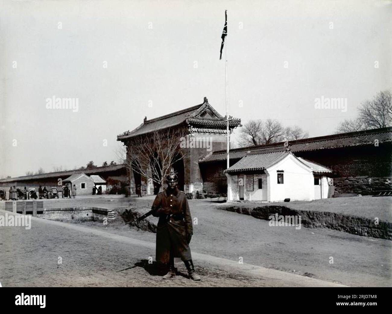 German soldier poses in front of the East gate of the Temple of Heaven ...