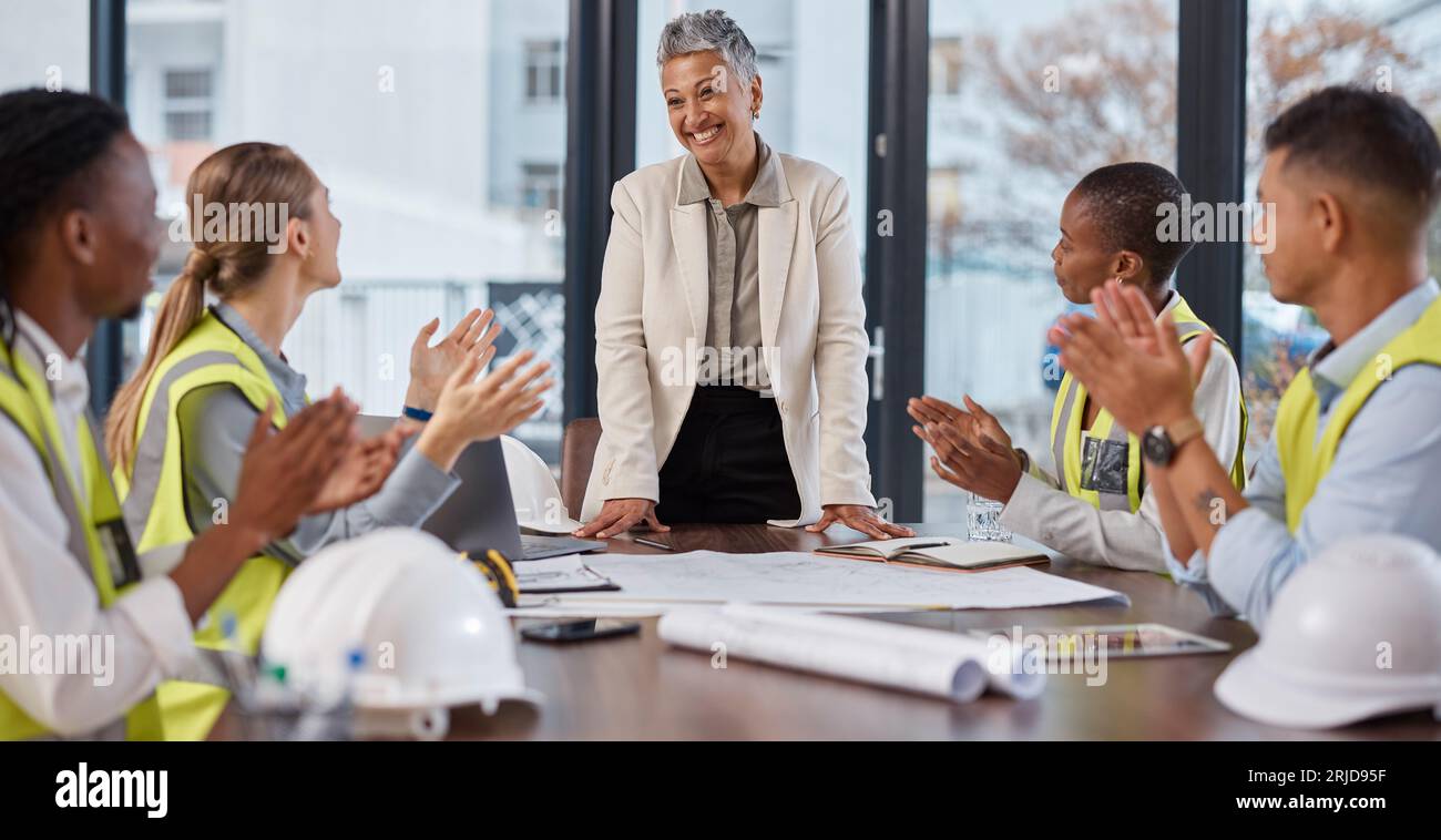 Applause, talking and construction workers in a meeting with a manager ...
