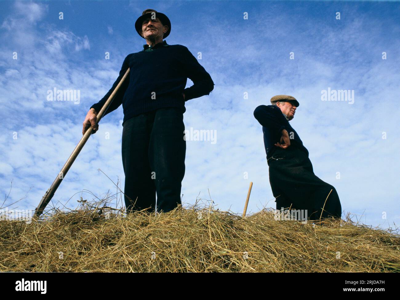 Farming rural west coast of southern Ireland 1970s. Two farmers ...