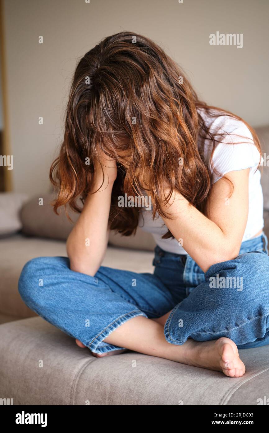 Sitting hands covering face crying sadness hi-res stock photography and ...