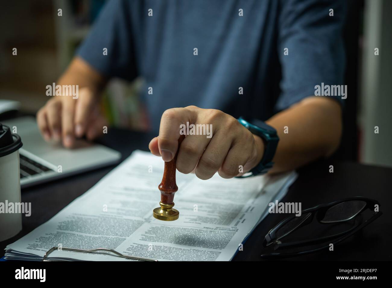 Businessman stamping with approved stamp on document contract. Business ...