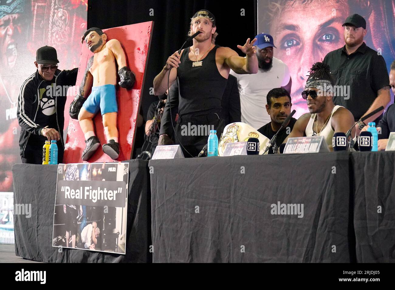 Logan Paul with a cake during a press conference at the OVO Arena ...
