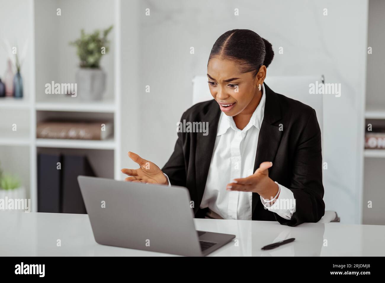 Working stress. Angry black businesswoman having problems with laptop ...