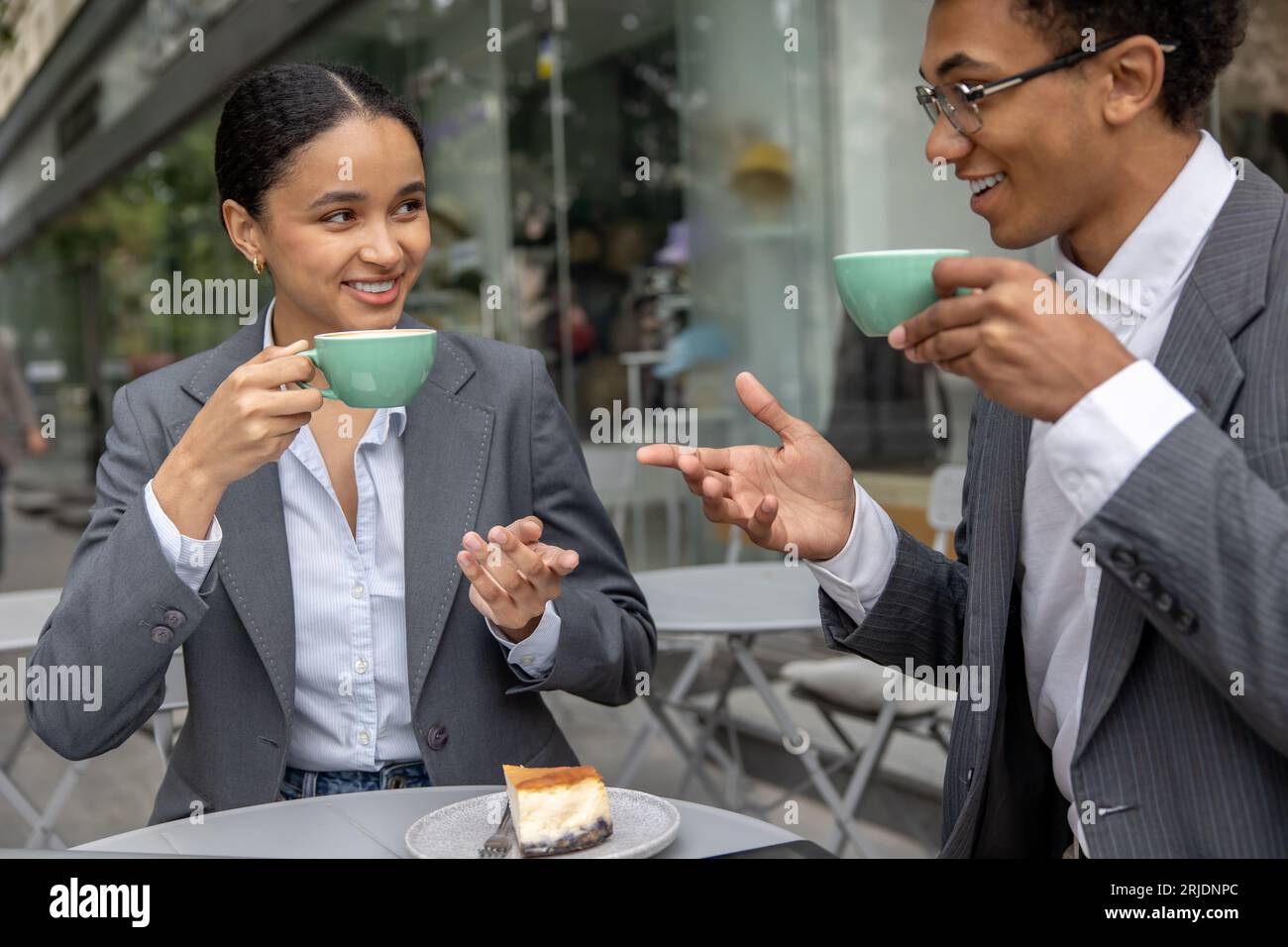 Business partners having coffee together Stock Photo - Alamy