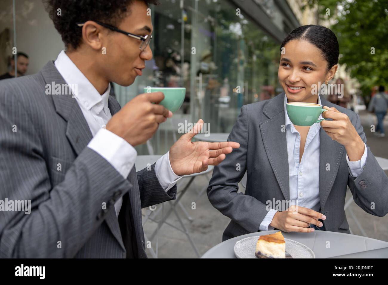 Business partners having coffee together Stock Photo - Alamy