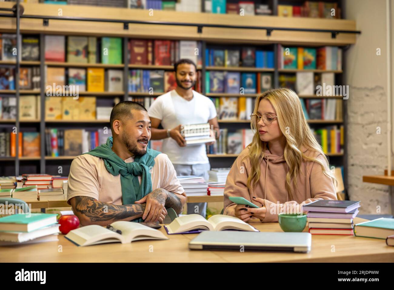 Group of people reading books in library Stock Photo - Alamy