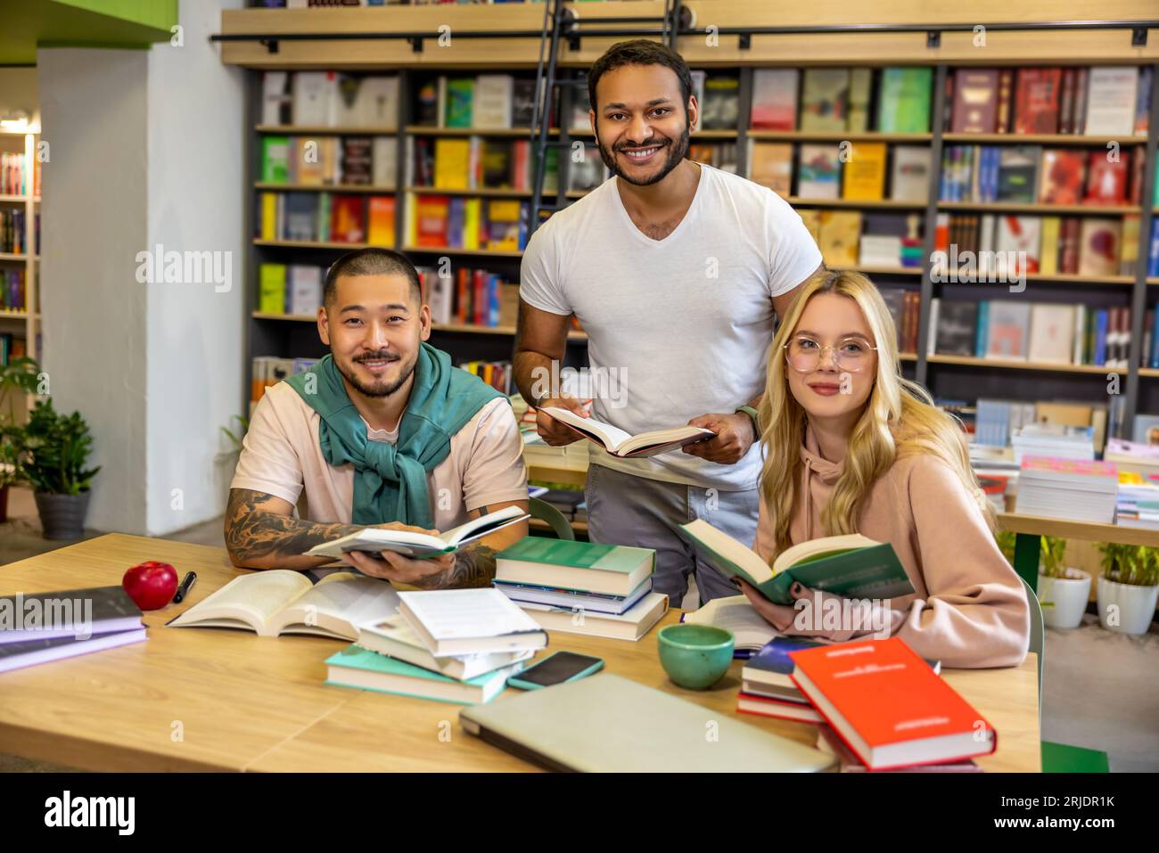 Group of people reading books in library Stock Photo - Alamy
