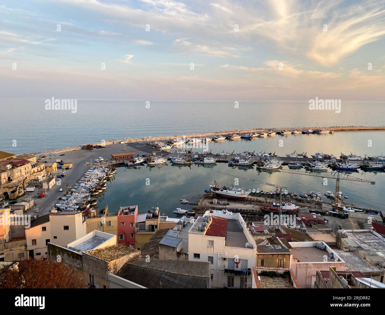 Sunset seascape with scenic view of the picturesque fishing port of ...