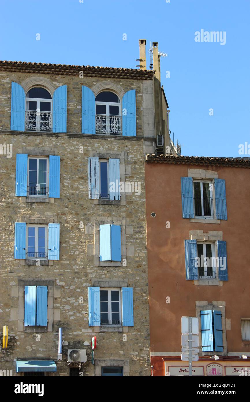 Blue shutters on the exterior of a building in the heart of Châteauneuf ...