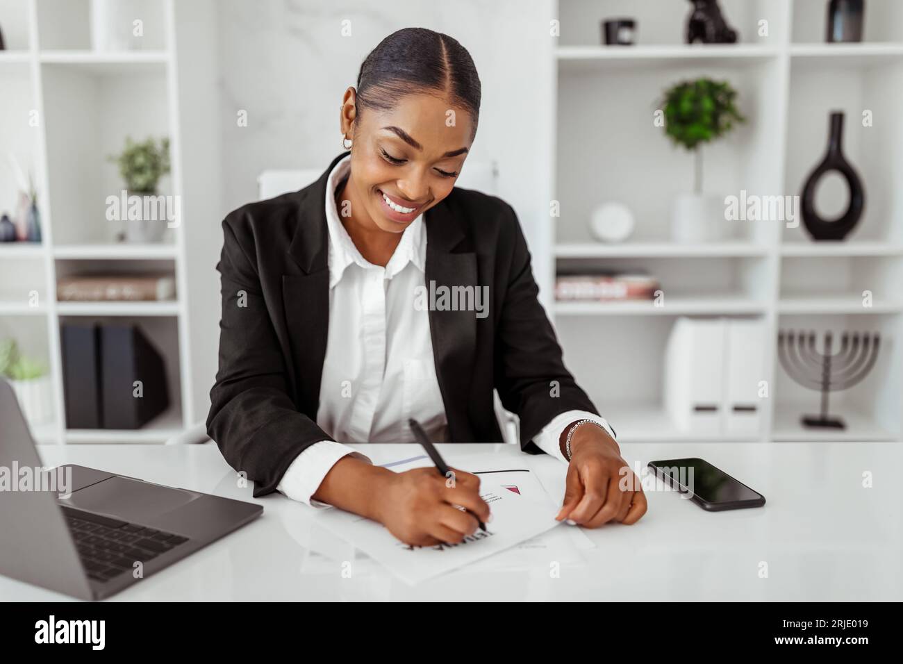 Office lady analyzing graphs hi-res stock photography and images - Alamy