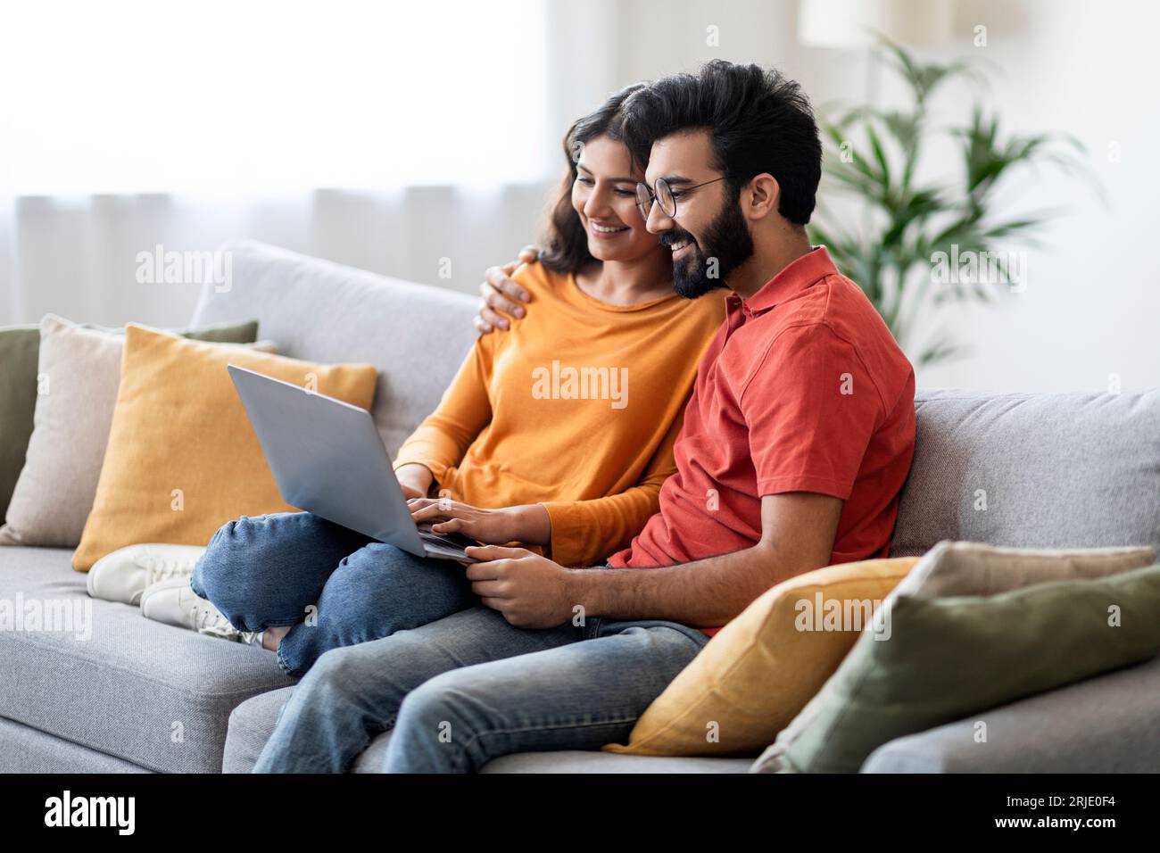 Happy indian couple browsing hi-res stock photography and images - Alamy