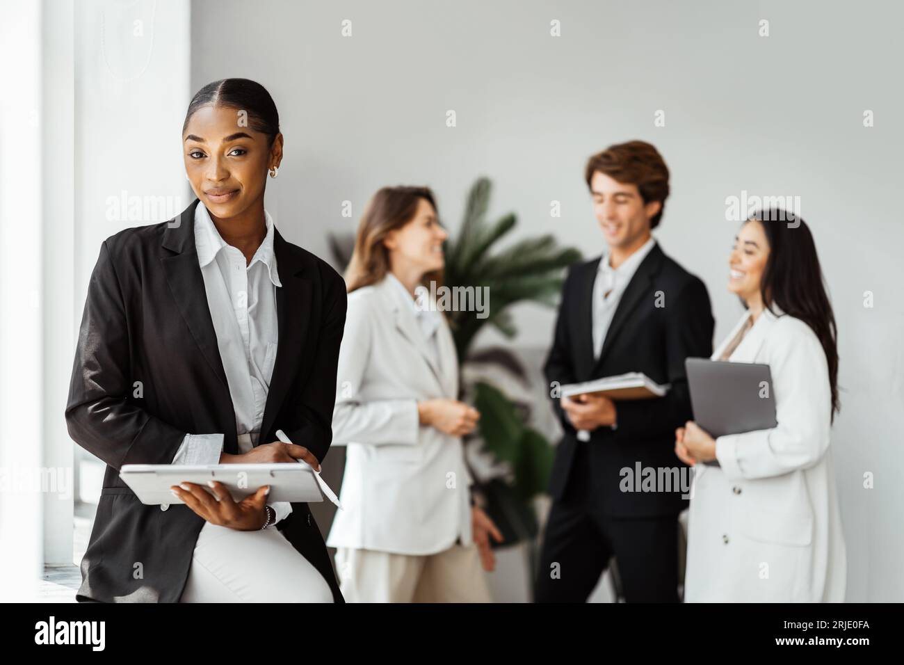 Attractive african american female director CEO sitting at the office ...