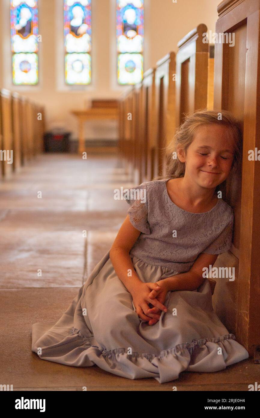 Little Girl Praying In Church
