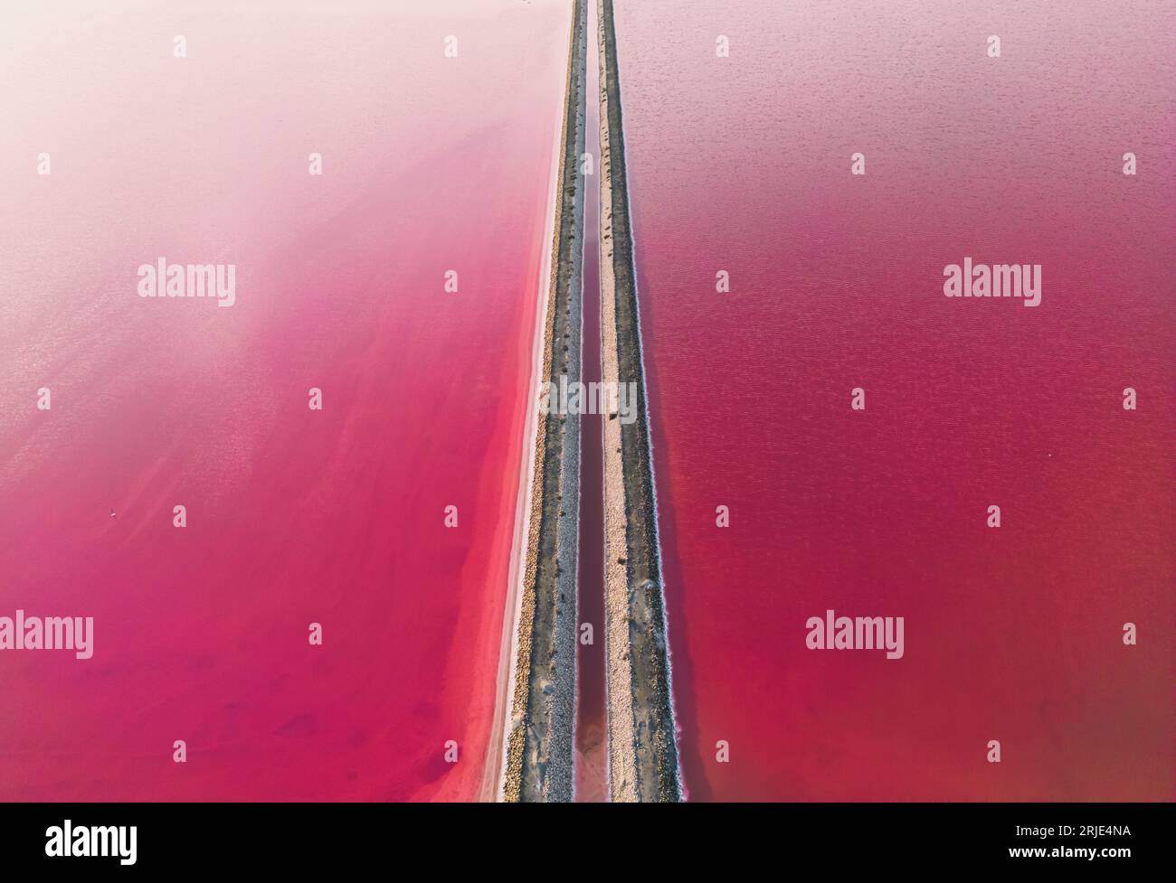 Aerial view of pink salt lake. Salt production plants evaporated brine ...
