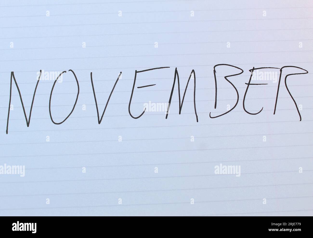 A photo of the month November written on a white lined page Stock Photo ...
