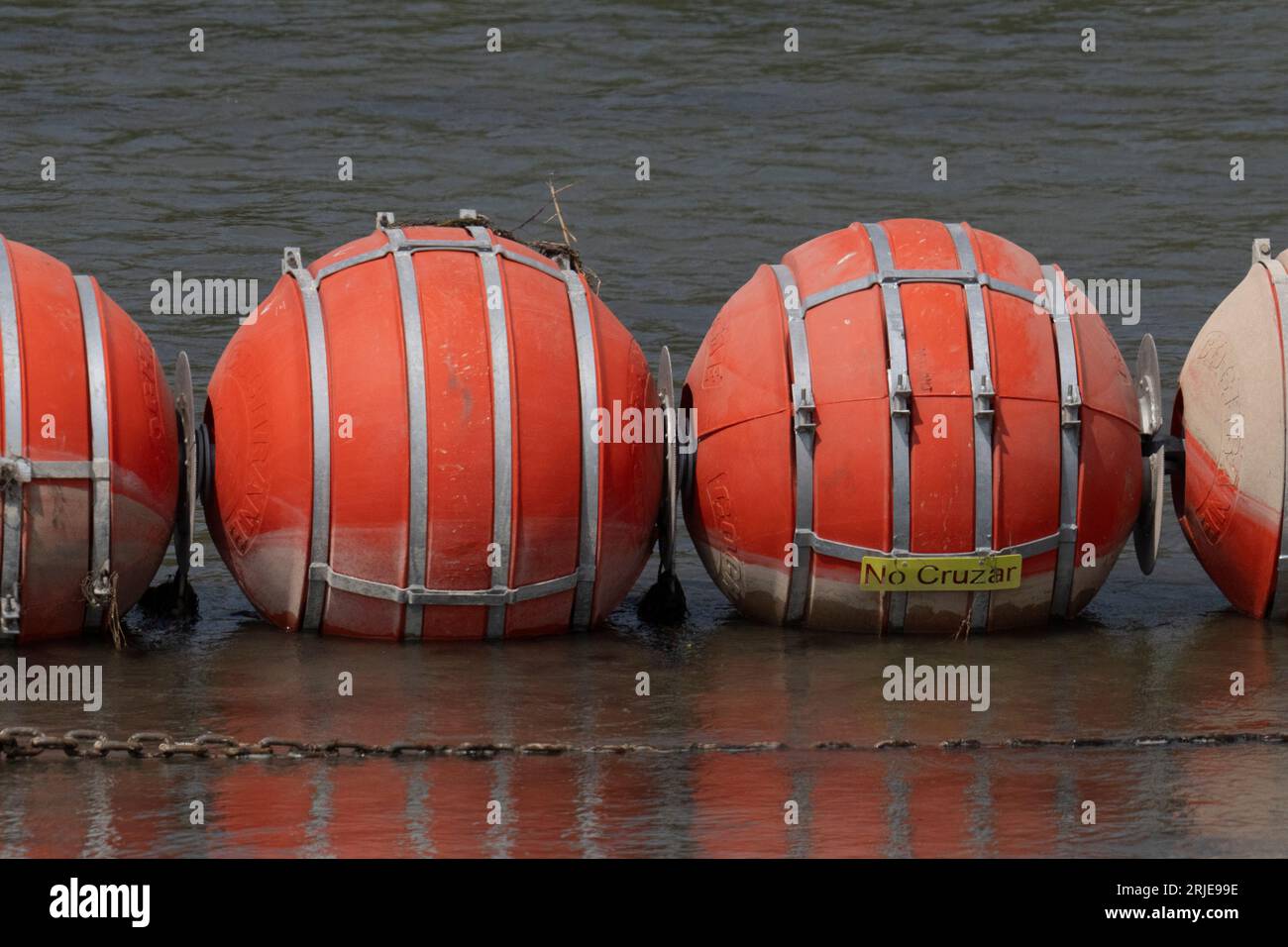 Eagle Pass, TX, USA. 21st Aug, 2023. Workmen reposition a 1000-foot ...