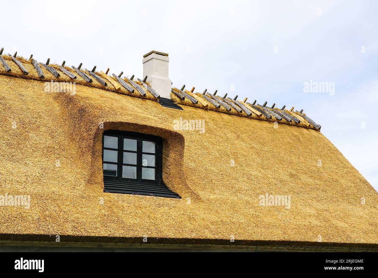 New thatch roof over house with dormer window in Denmark, Europe ...