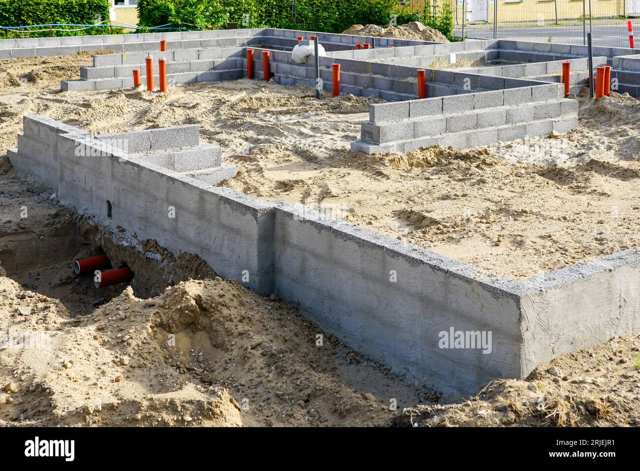 Building foundations of the house from cement blocks with simultaneous ...