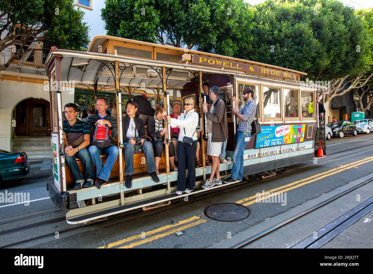 Cable Car driving down the street Powell and Hyde Line San Francisco ...