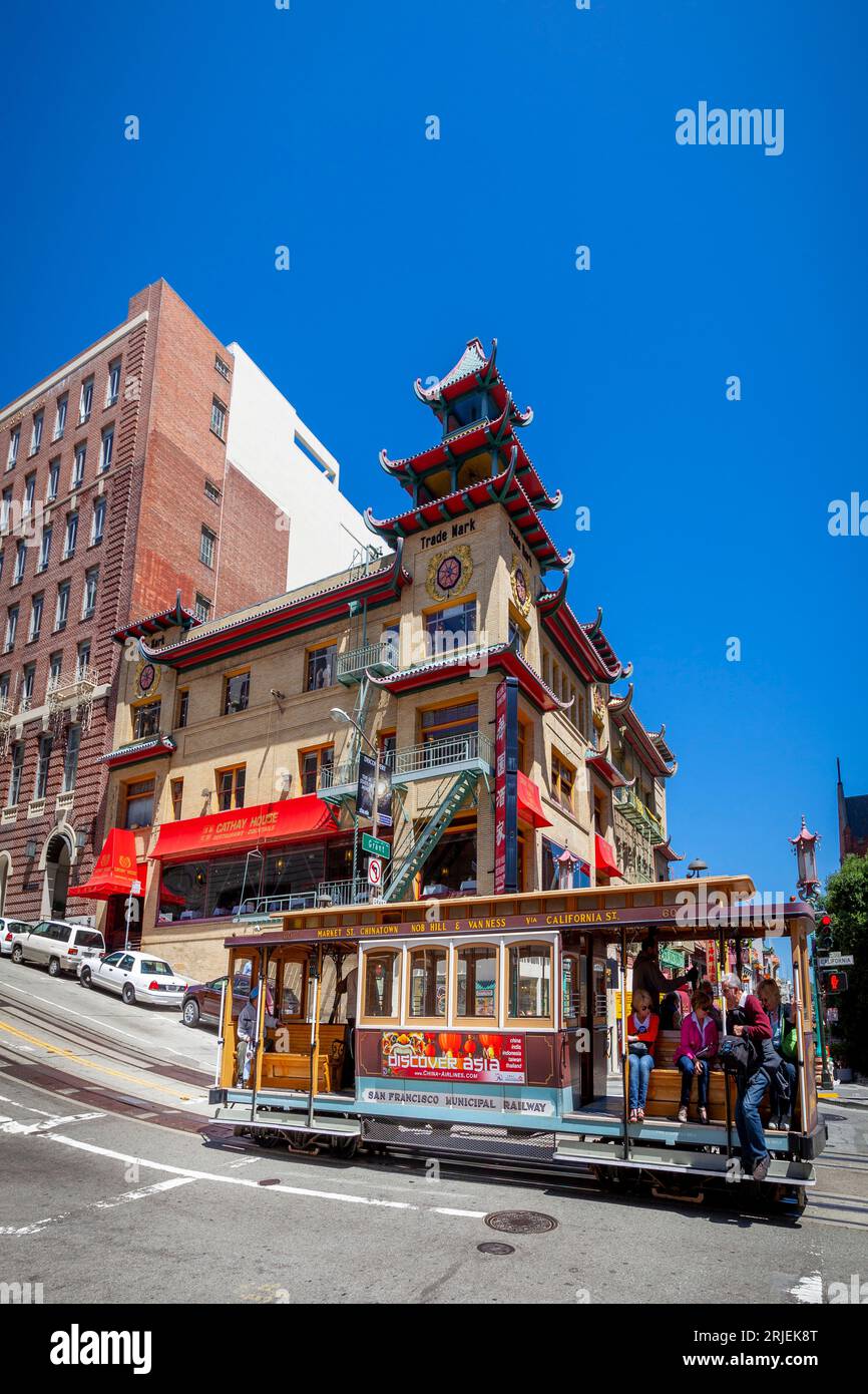 Cable Car driving up the hill in Chinatown, San Francisco California ...