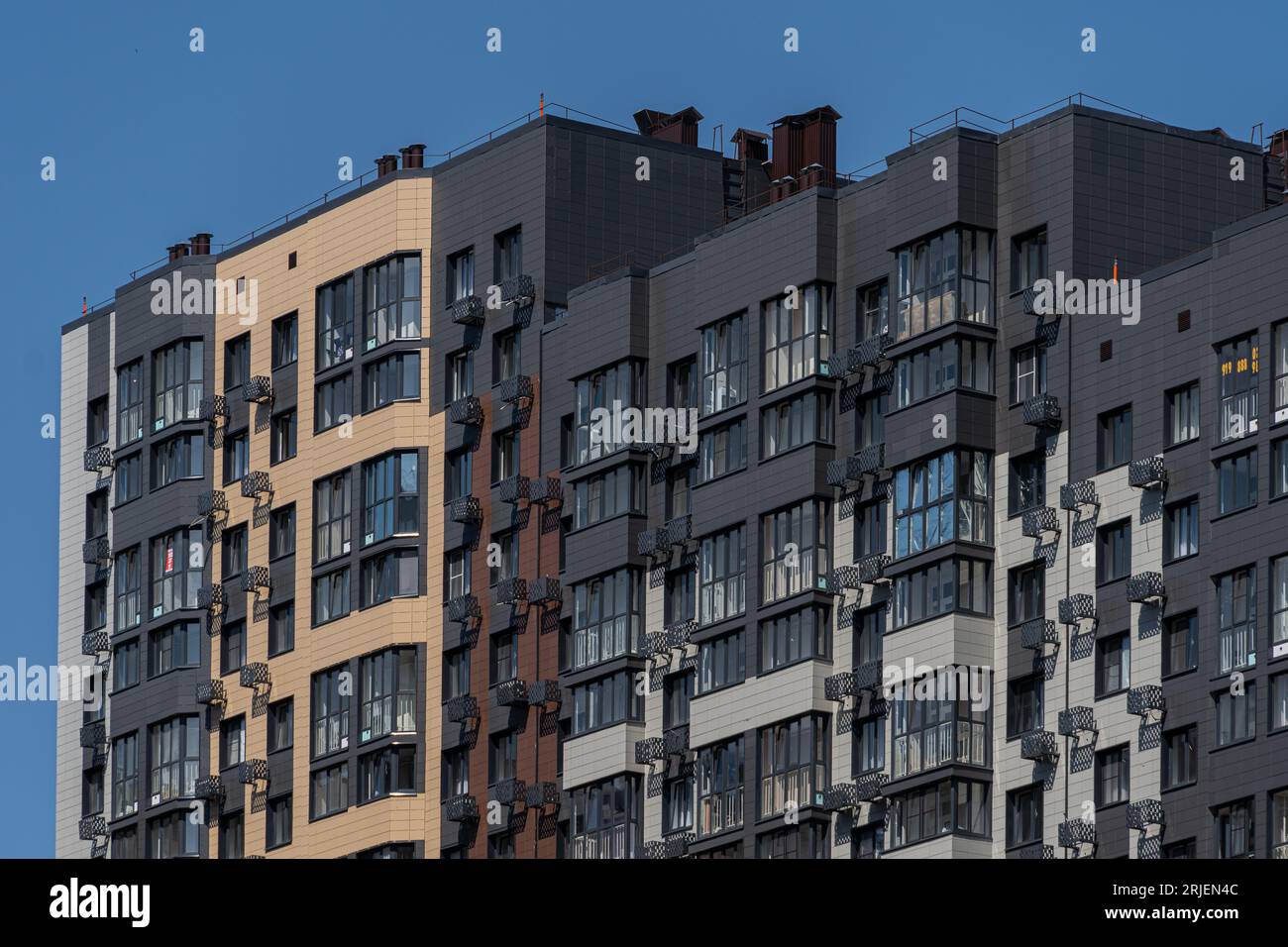 New building facade in housing complex. Modern style in architecture ...