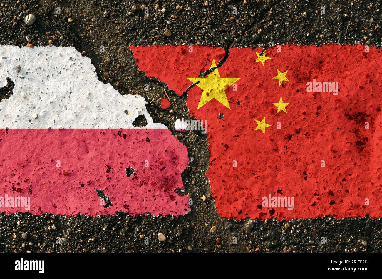 On the pavement are images of the flags of Poland and China, as a ...